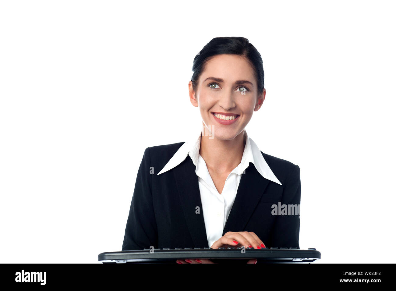 Beautiful young lady typing on a keyboard Stock Photo - Alamy
