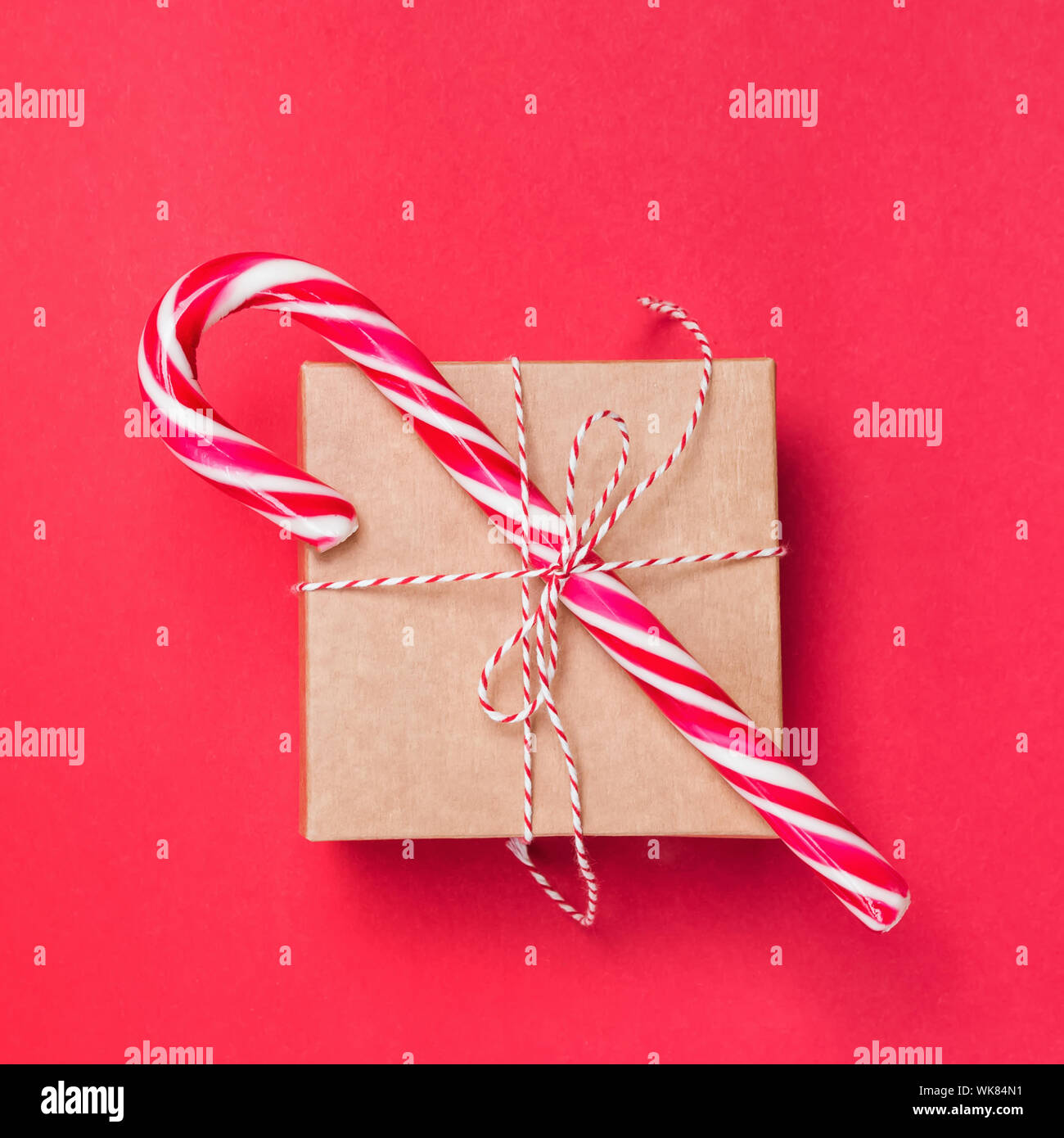 Christmas giftbox decorated with candy cane Stock Photo - Alamy