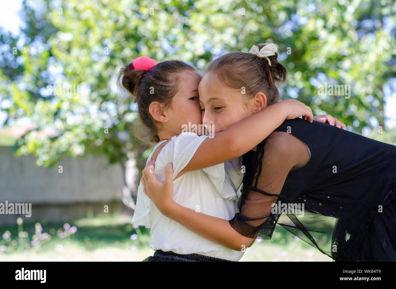 Two sisters hugging hi-res stock photography and images - Alamy