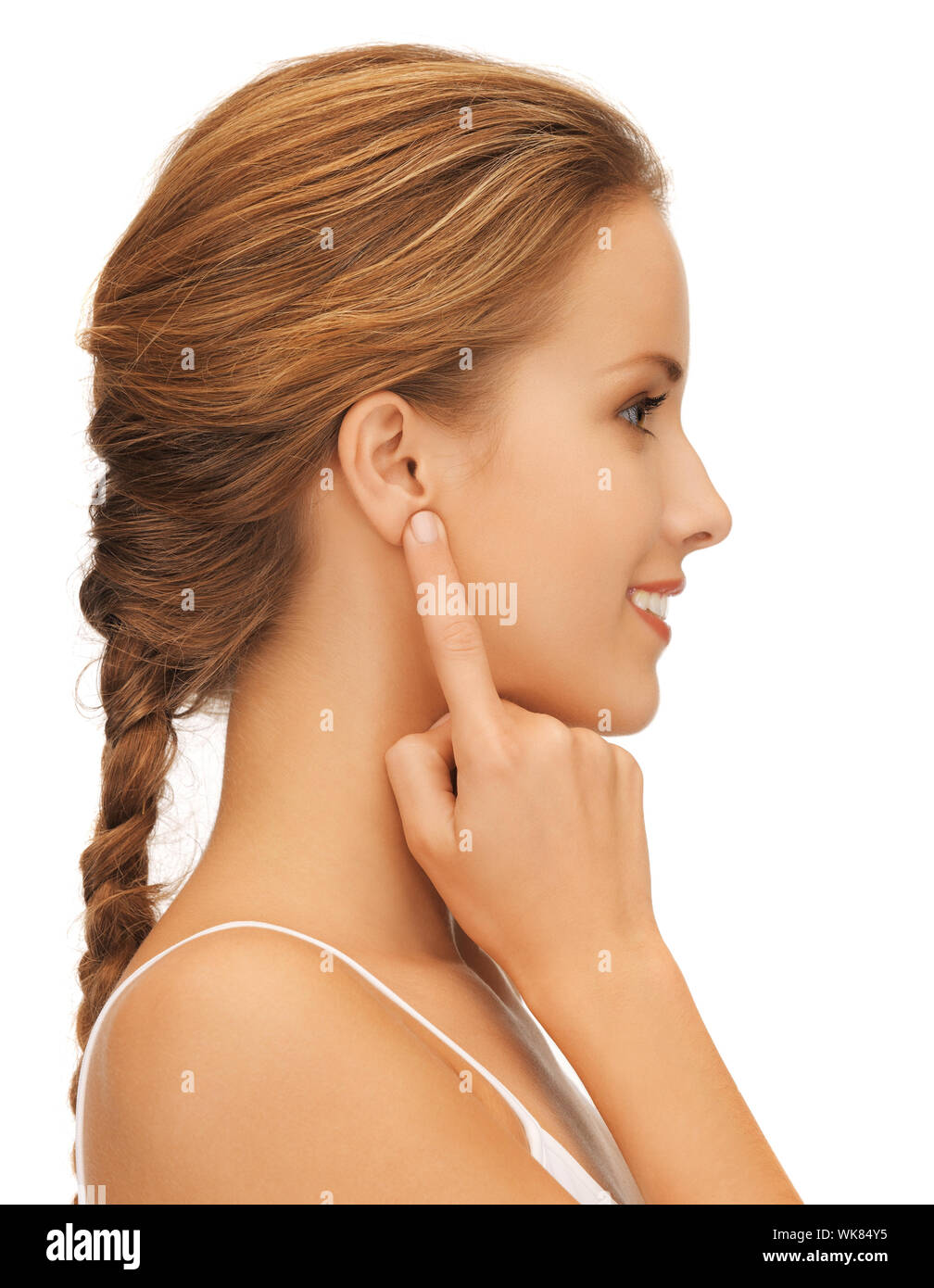 woman pointing to ear Stock Photo - Alamy