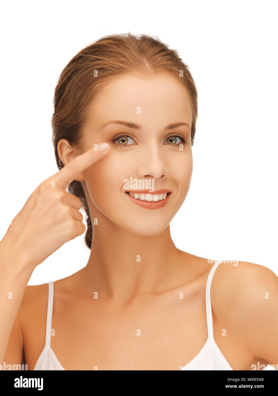 beautiful woman pointing to eye Stock Photo - Alamy