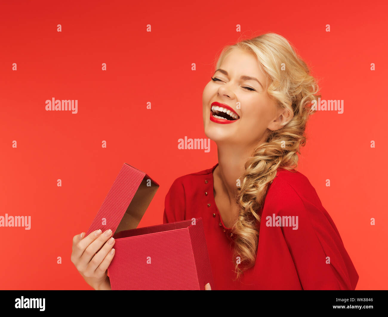 picture of lovely woman in red dress with opened gift box Stock Photo ...