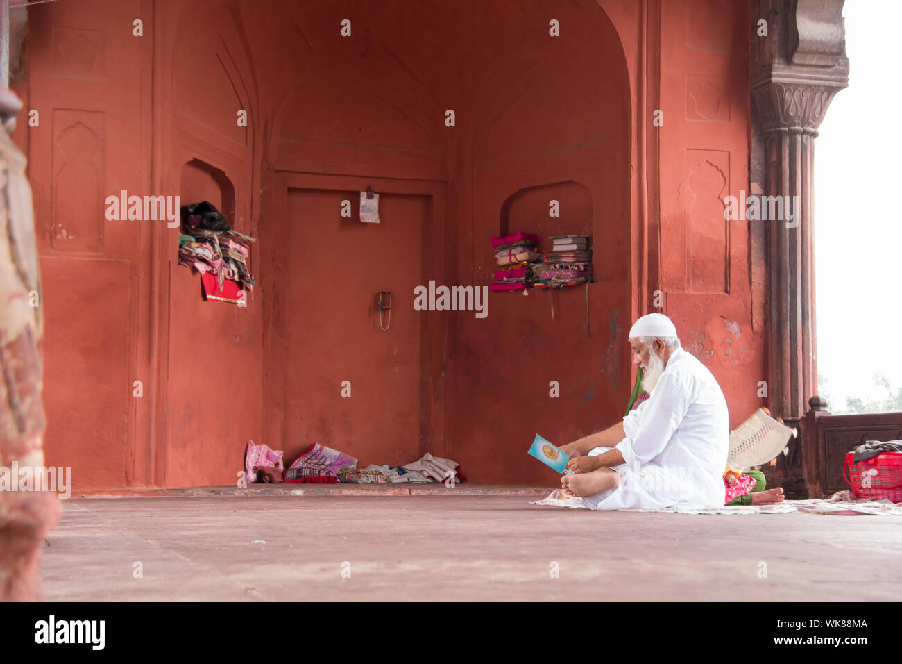 Man reading Quran in mosque, Jama Masjid, Old Delhi, India Stock Photo ...