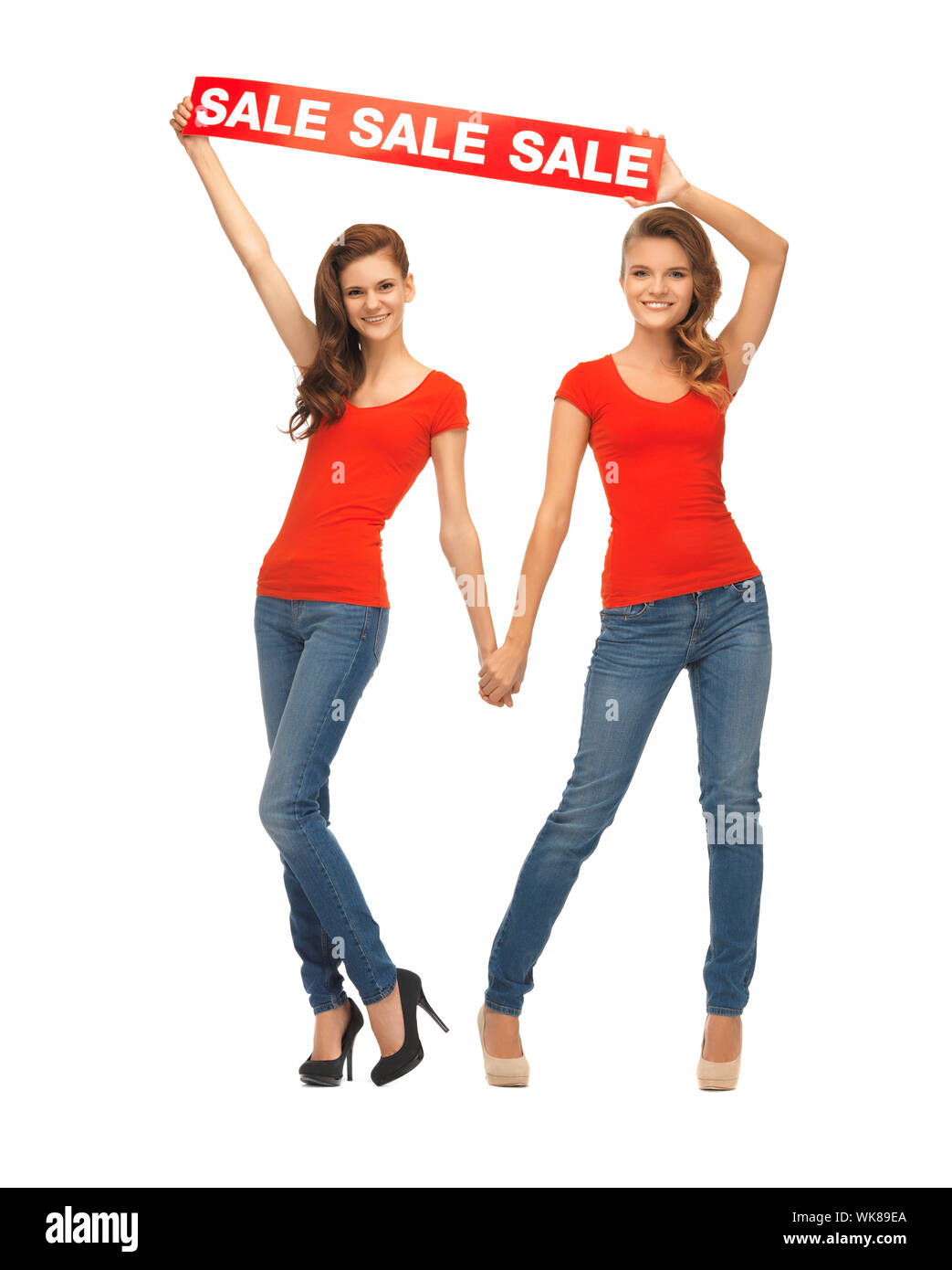 two teenage girls with sale sign Stock Photo - Alamy