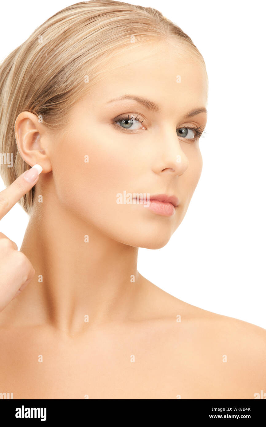 woman pointing to ear Stock Photo - Alamy