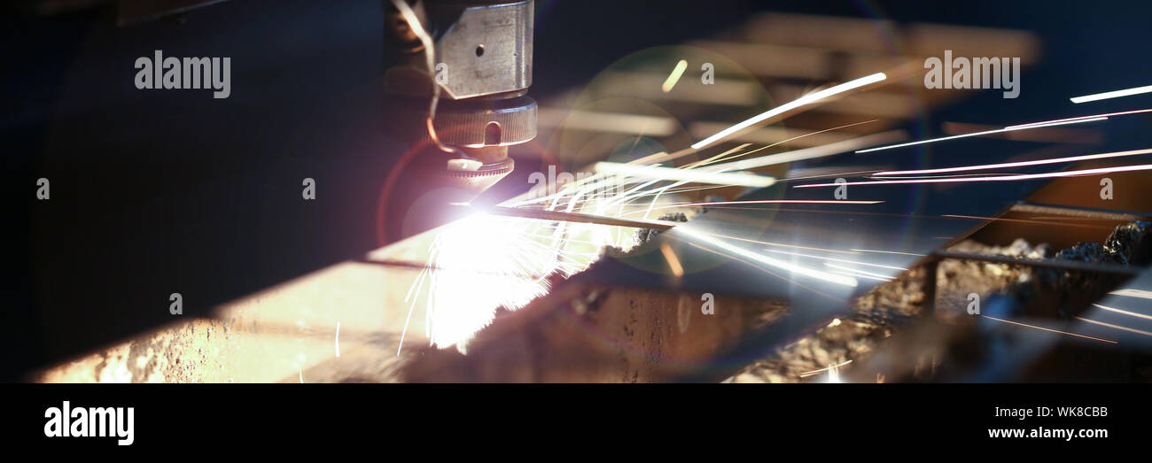 Laser metall cut cnc machine. Fly fire sparks background Stock Photo ...