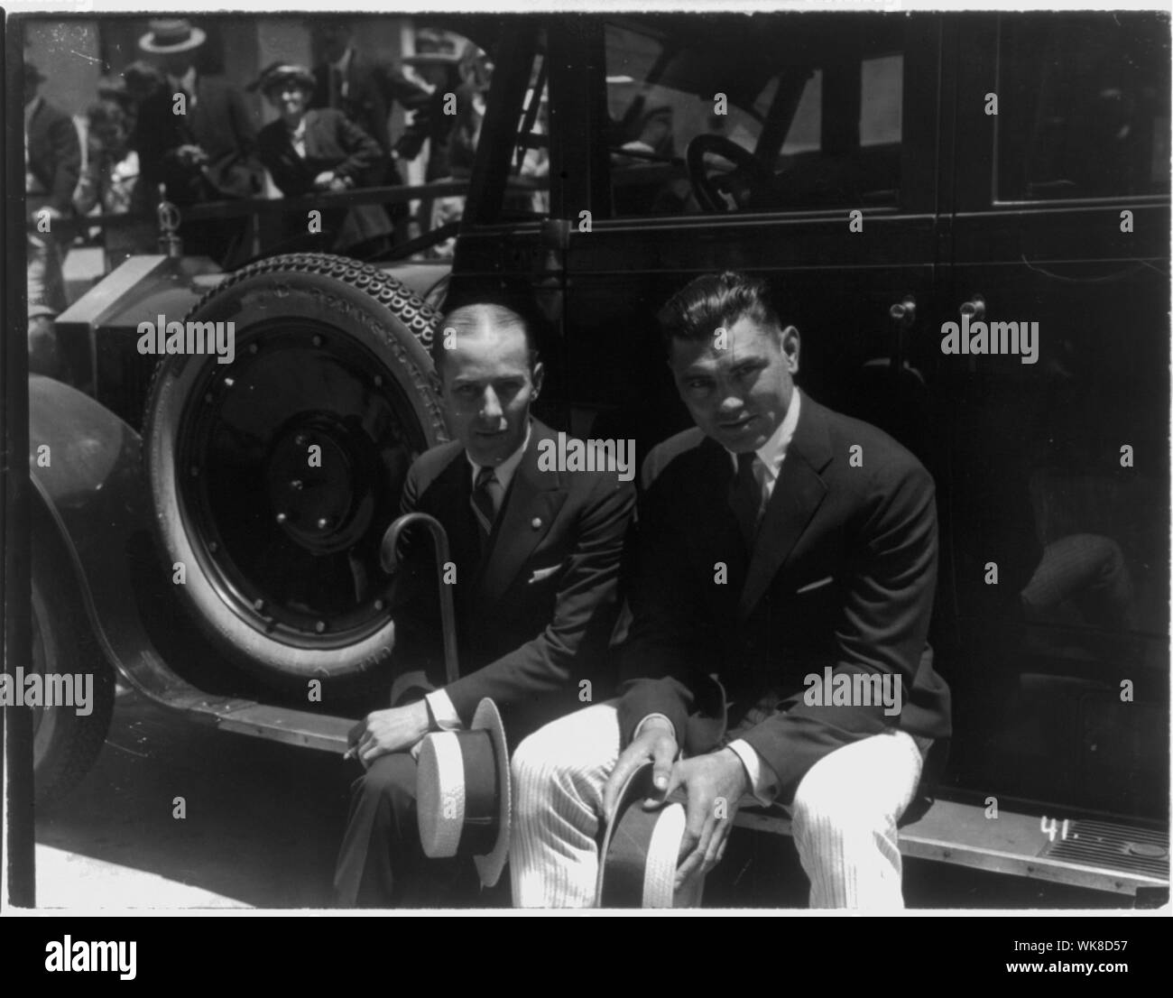 Jack Dempsey at his training camp, June 1921: seated with man on auto ...