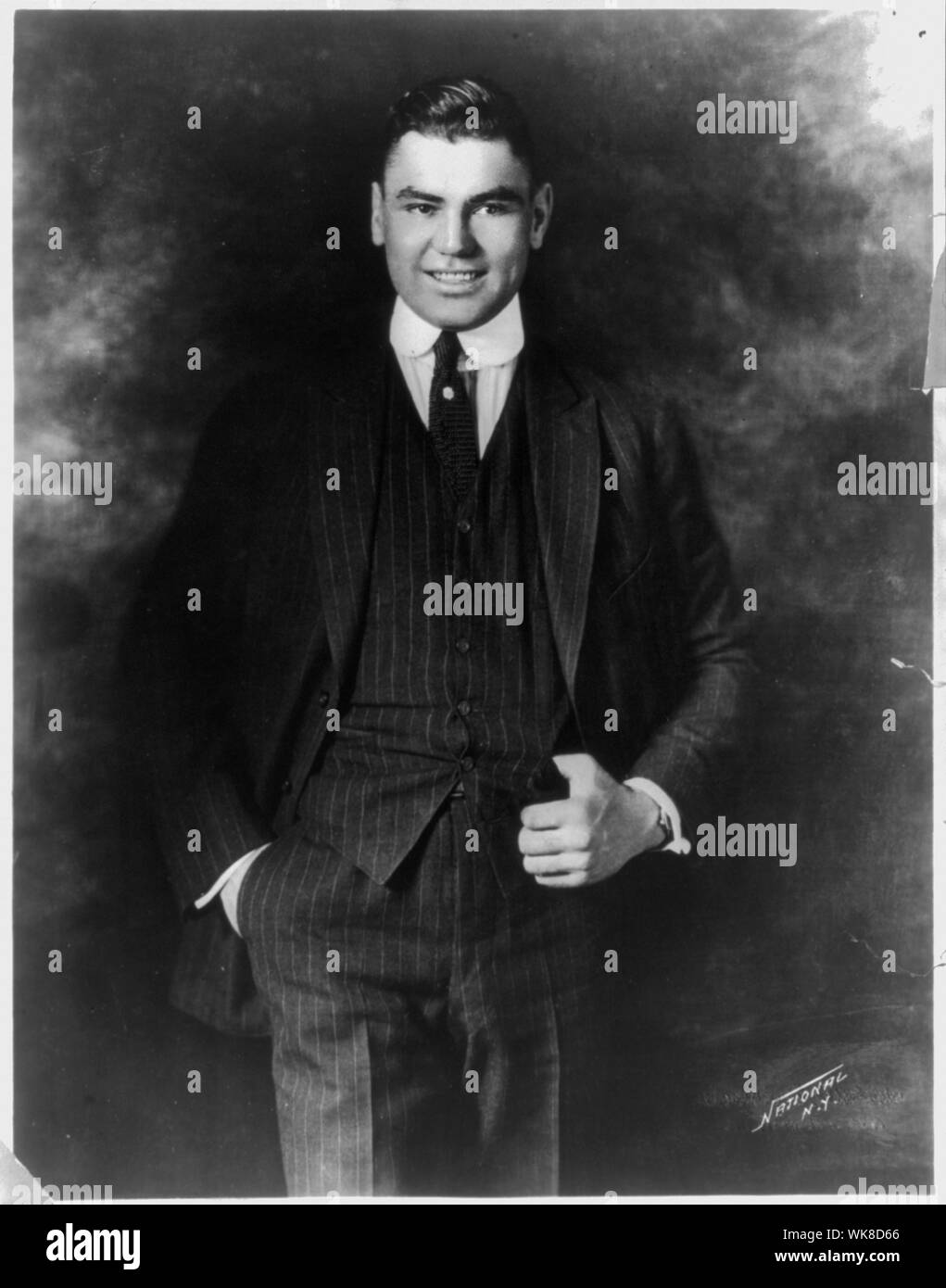 Jack Dempsey, 1895- , three-quarter length portrait, standing, facing ...