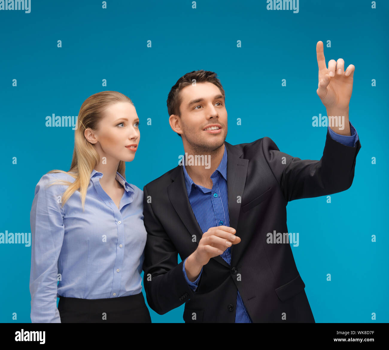 picture of man and woman working with something imaginary Stock Photo ...