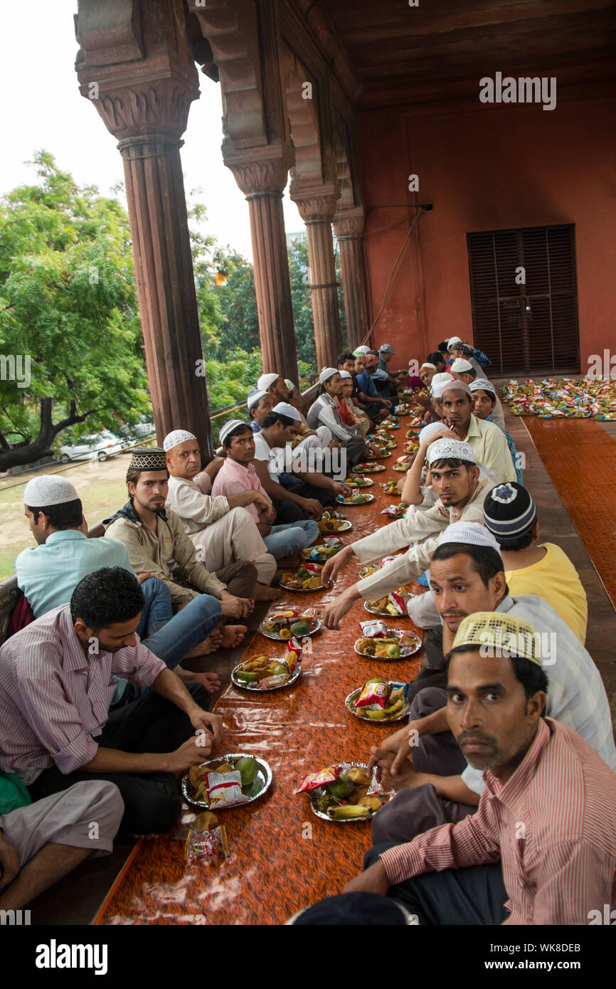 People breaking fast during iftar at a mosque, Jama Masjid, Old Delhi ...