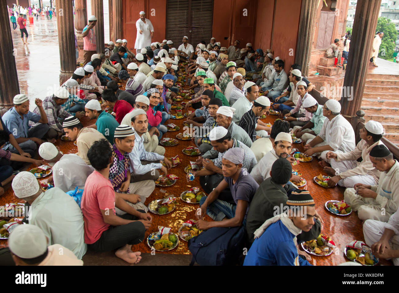 People breaking fast during iftar at a mosque, Jama Masjid, Old Delhi ...