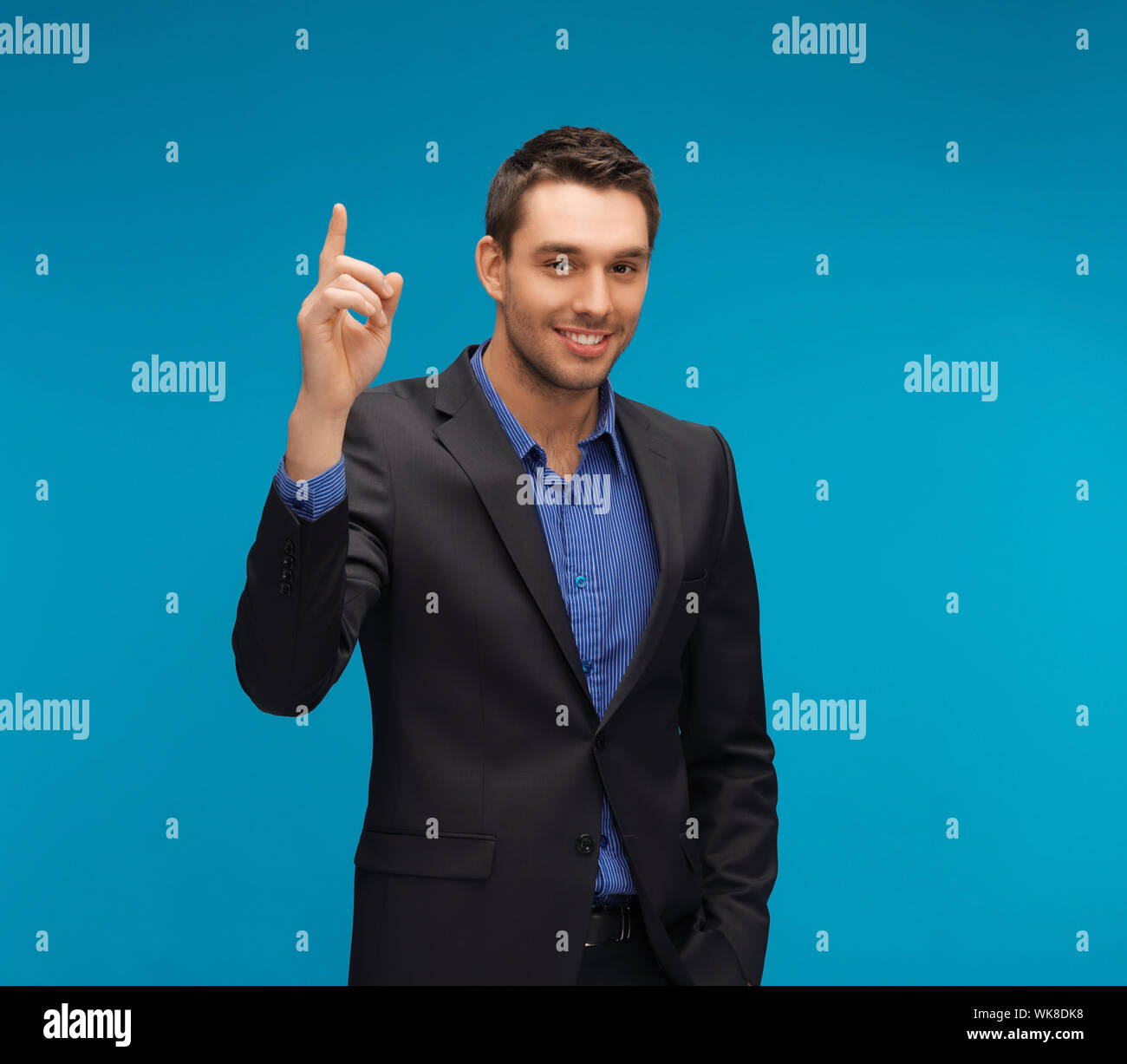 man in suit with his finger up Stock Photo - Alamy