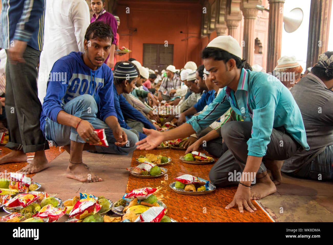 People breaking fast during iftar at a mosque, Jama Masjid, Old Delhi ...
