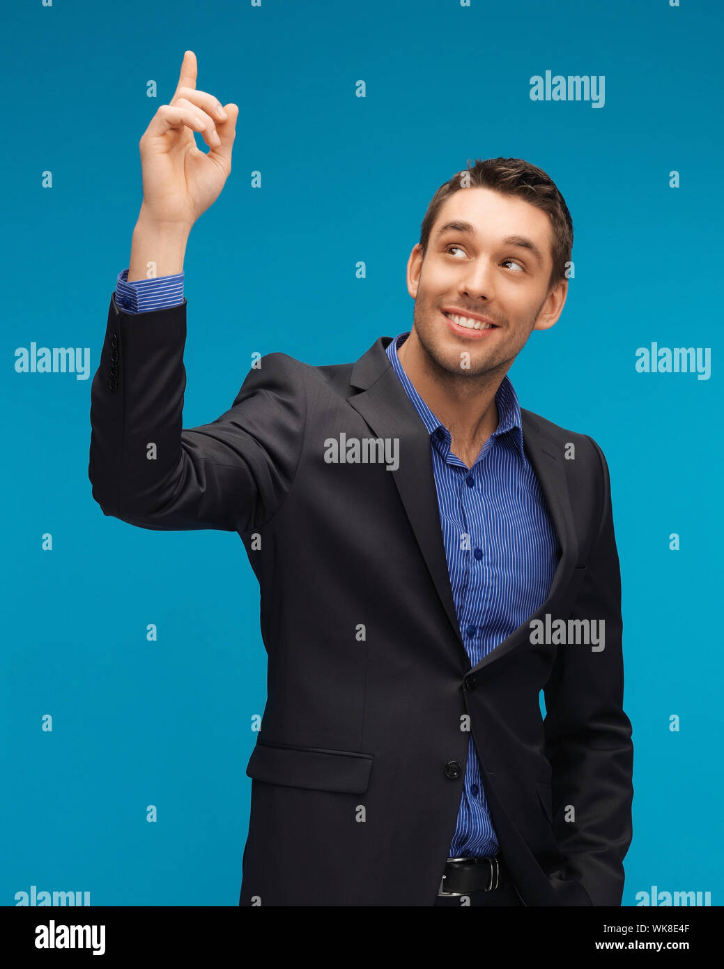 picture of man in suit with his finger up Stock Photo - Alamy