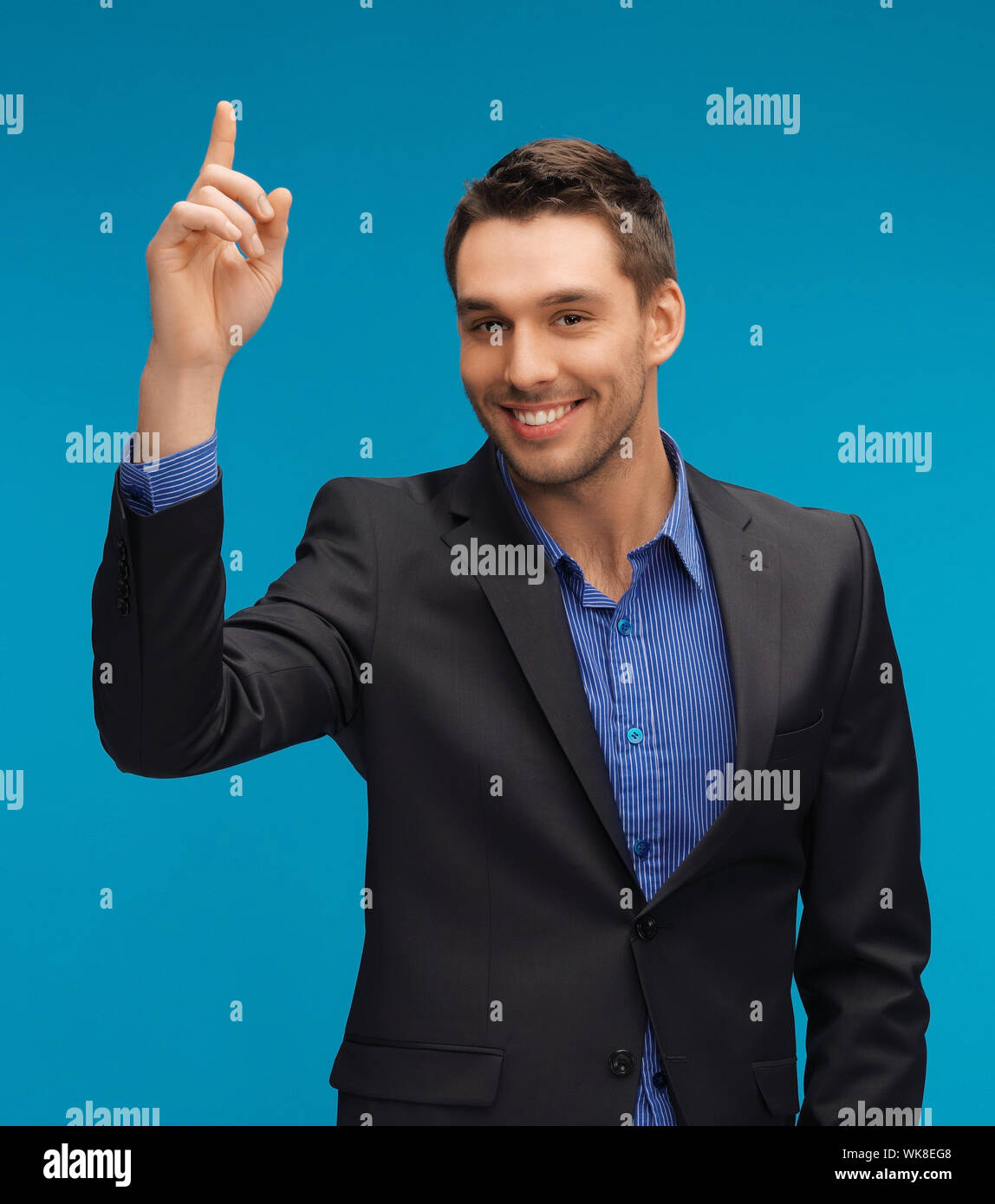 man in suit with his finger up Stock Photo - Alamy