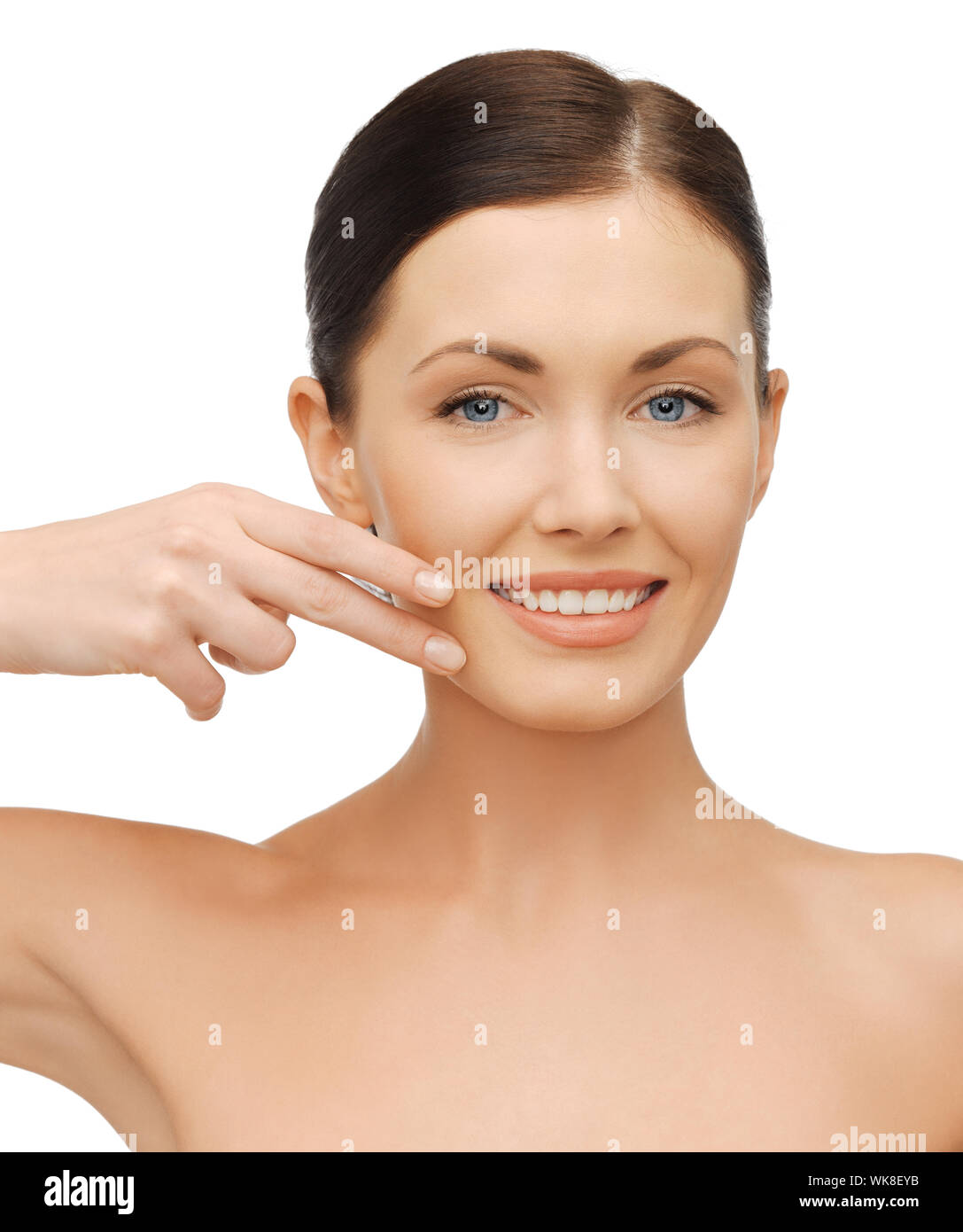 bright picture of beautiful woman pointing to cheek Stock Photo - Alamy
