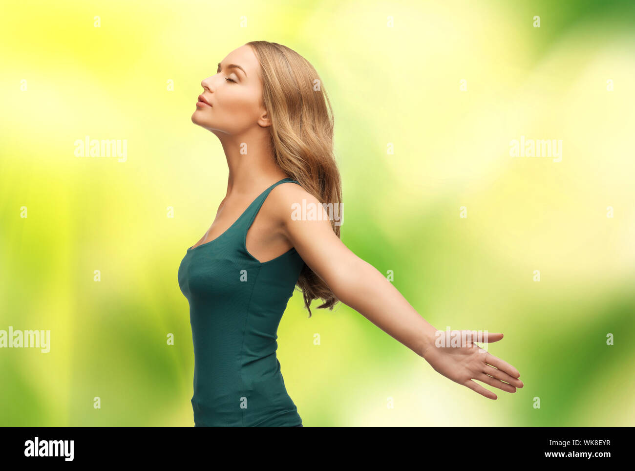 picture of calm and serious woman spreading hands Stock Photo - Alamy