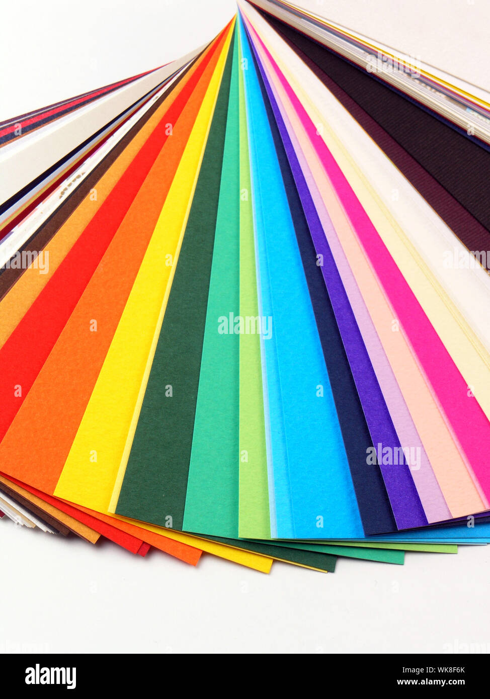 Colored samples of different papers on white background, business cards ...