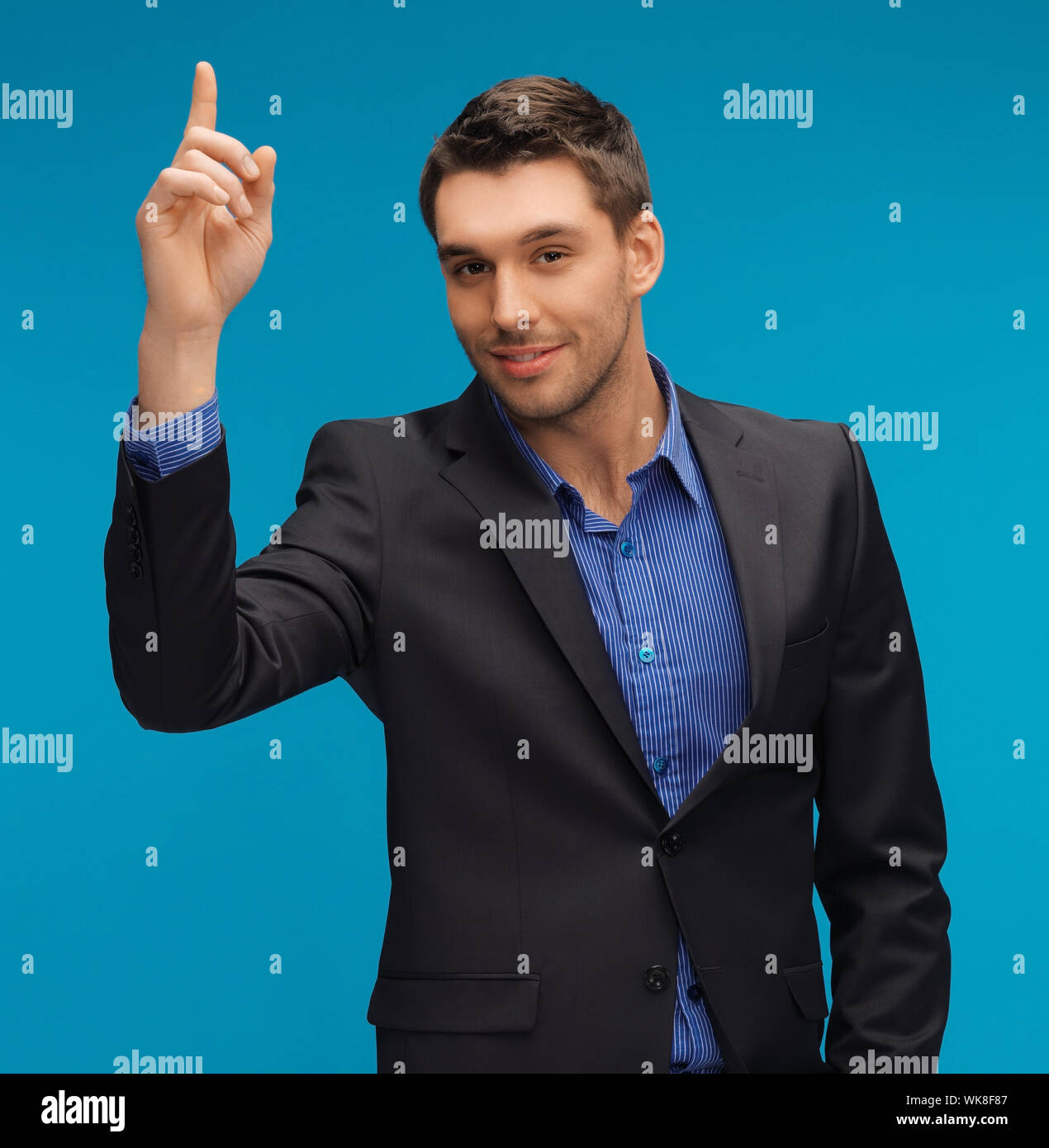 picture of man in suit with his finger up Stock Photo - Alamy
