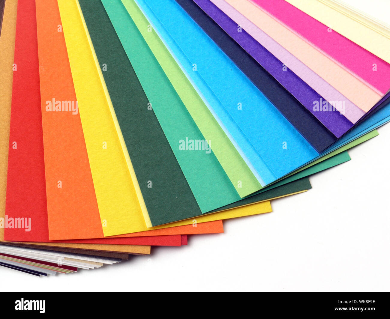 Colored samples of different papers on white background, business cards ...