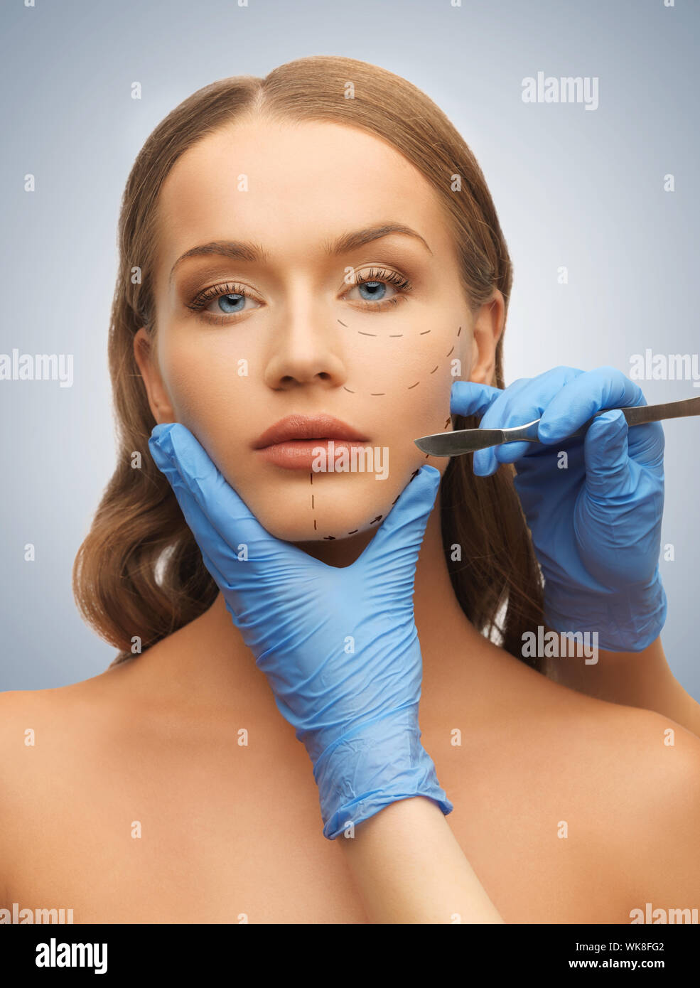 picture of woman face and beautician hands with scalpel Stock Photo - Alamy