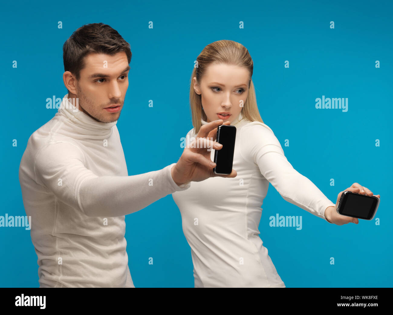 man and woman with modern gadgets Stock Photo - Alamy
