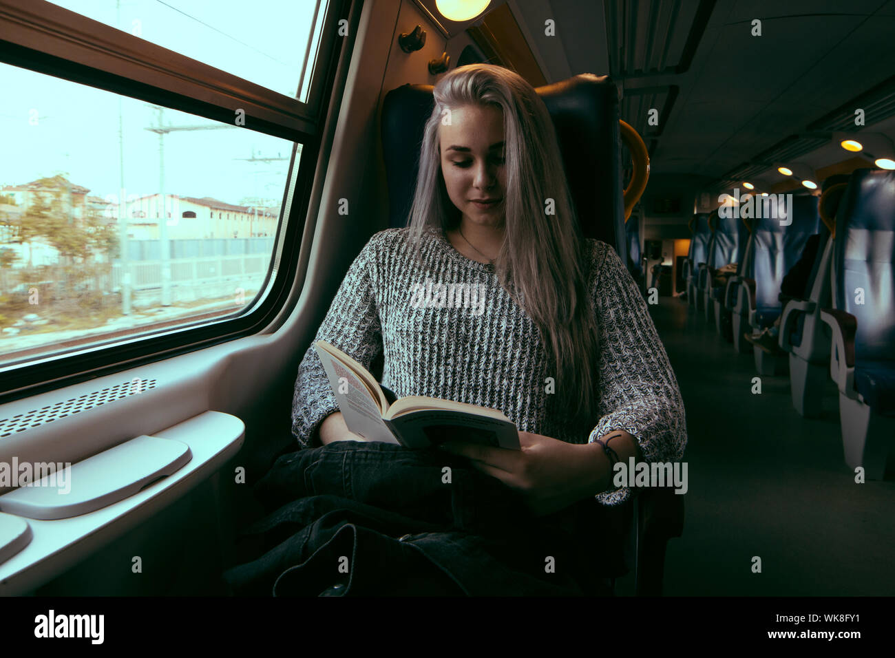 Woman sitting in train hi-res stock photography and images - Alamy
