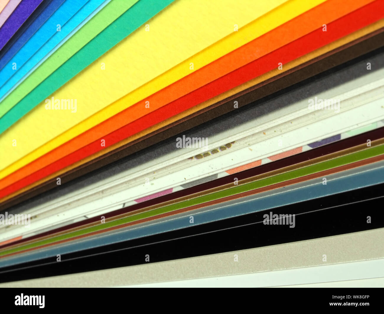 Colored samples of different papers on white background, business cards ...