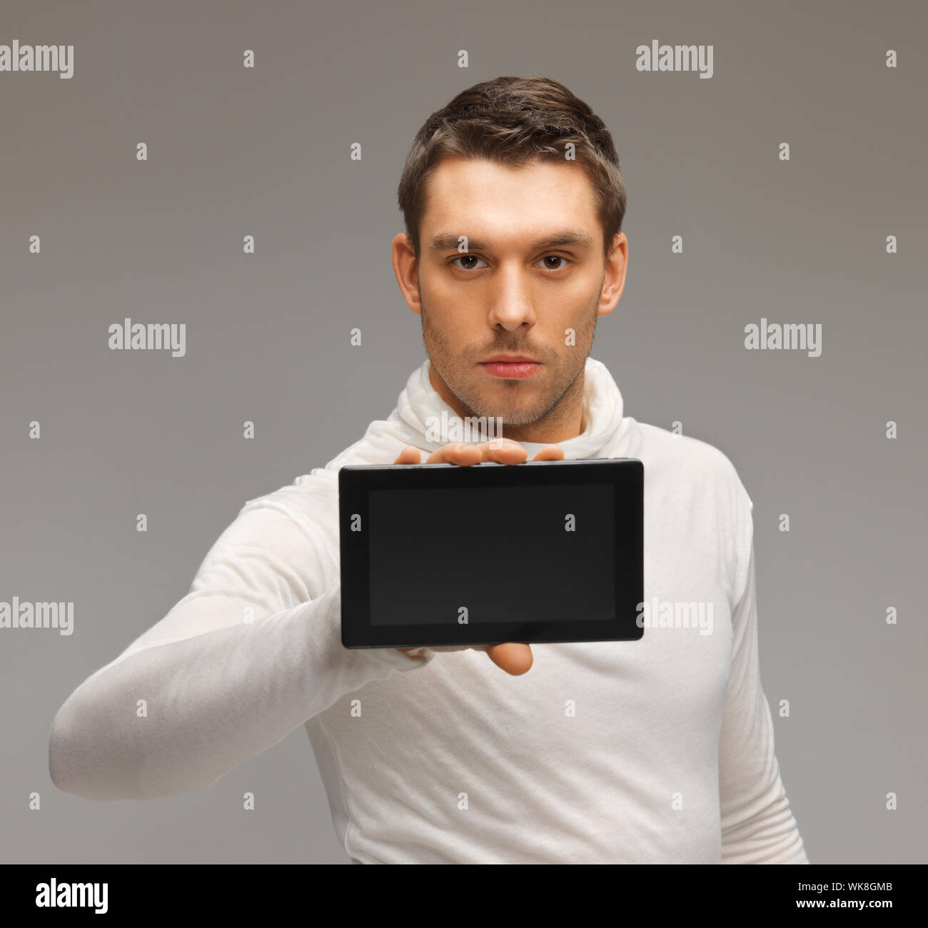 bright picture of futuristic man with tablet pc Stock Photo - Alamy