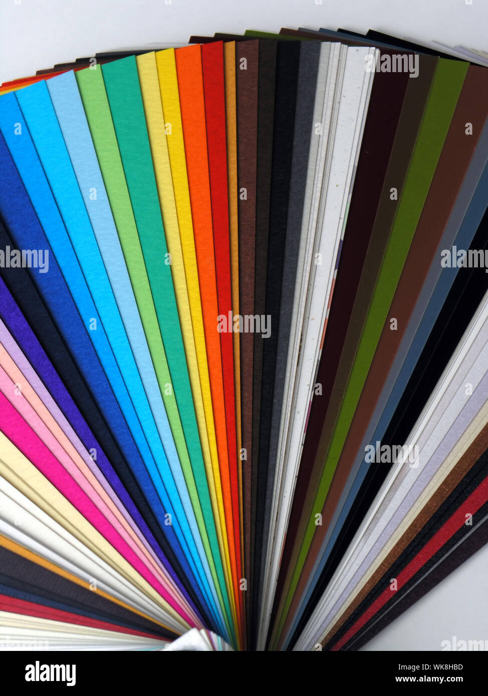 Colored samples of different papers on white background, business cards ...