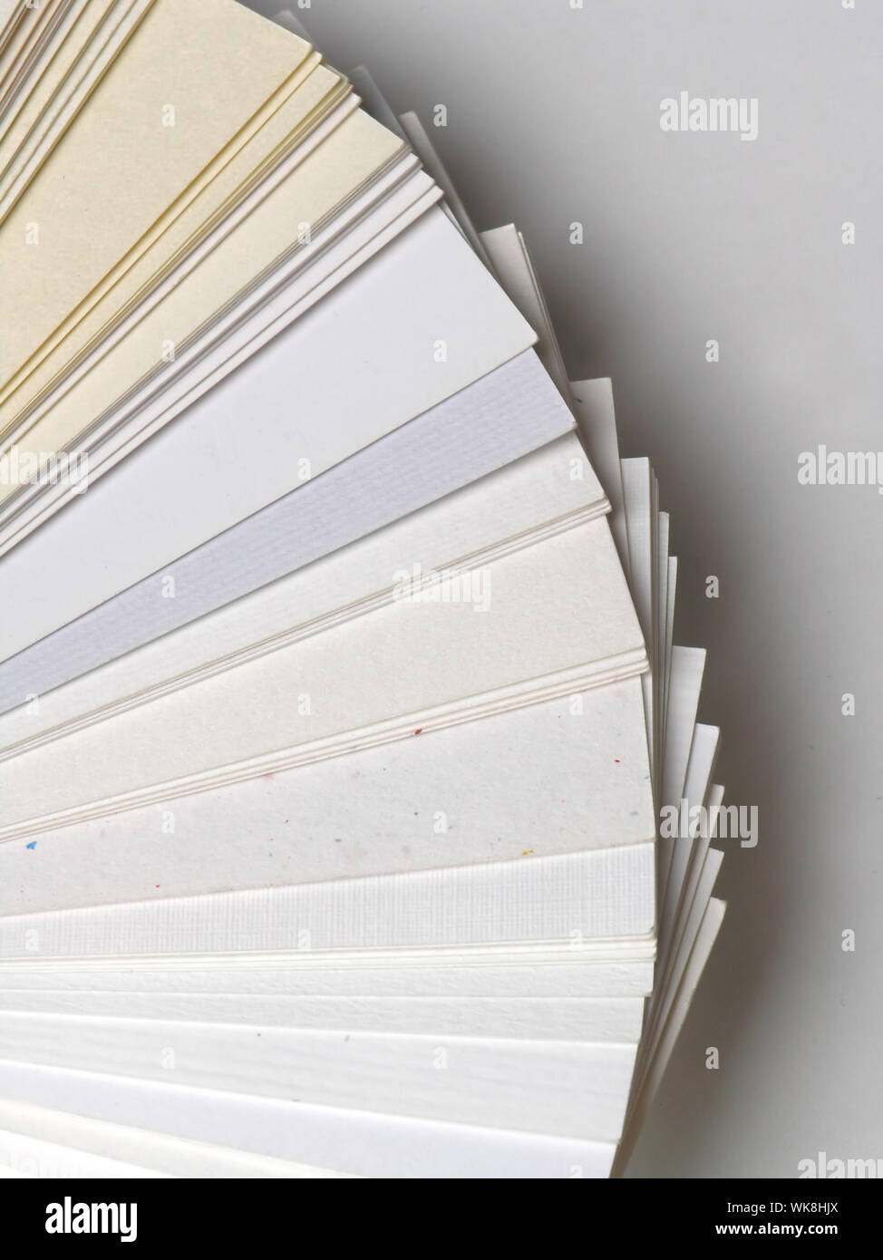 Colored samples of different papers on white background, business cards ...