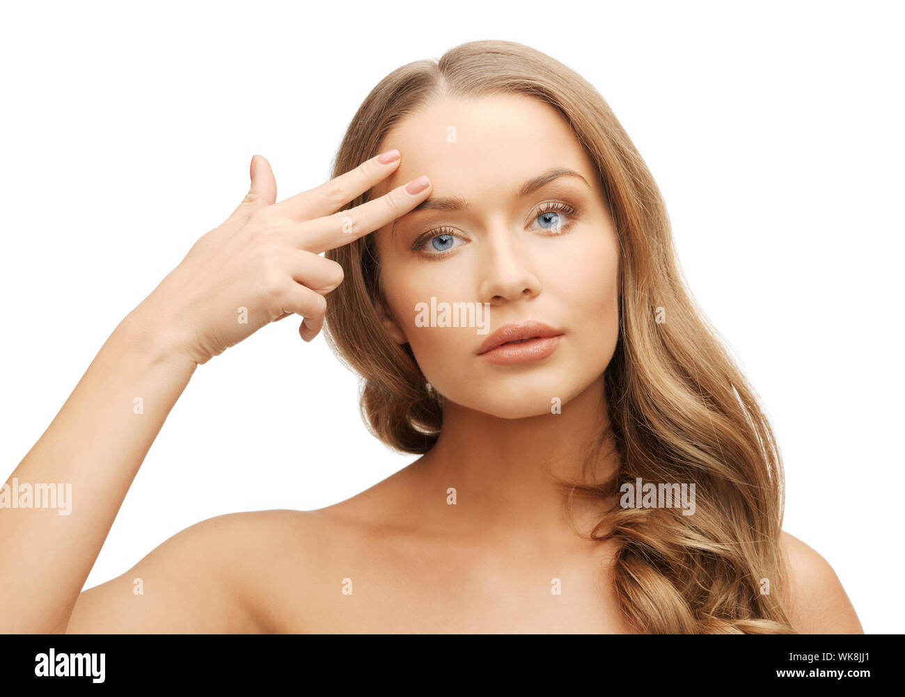 beautiful woman pointing to forehead Stock Photo - Alamy