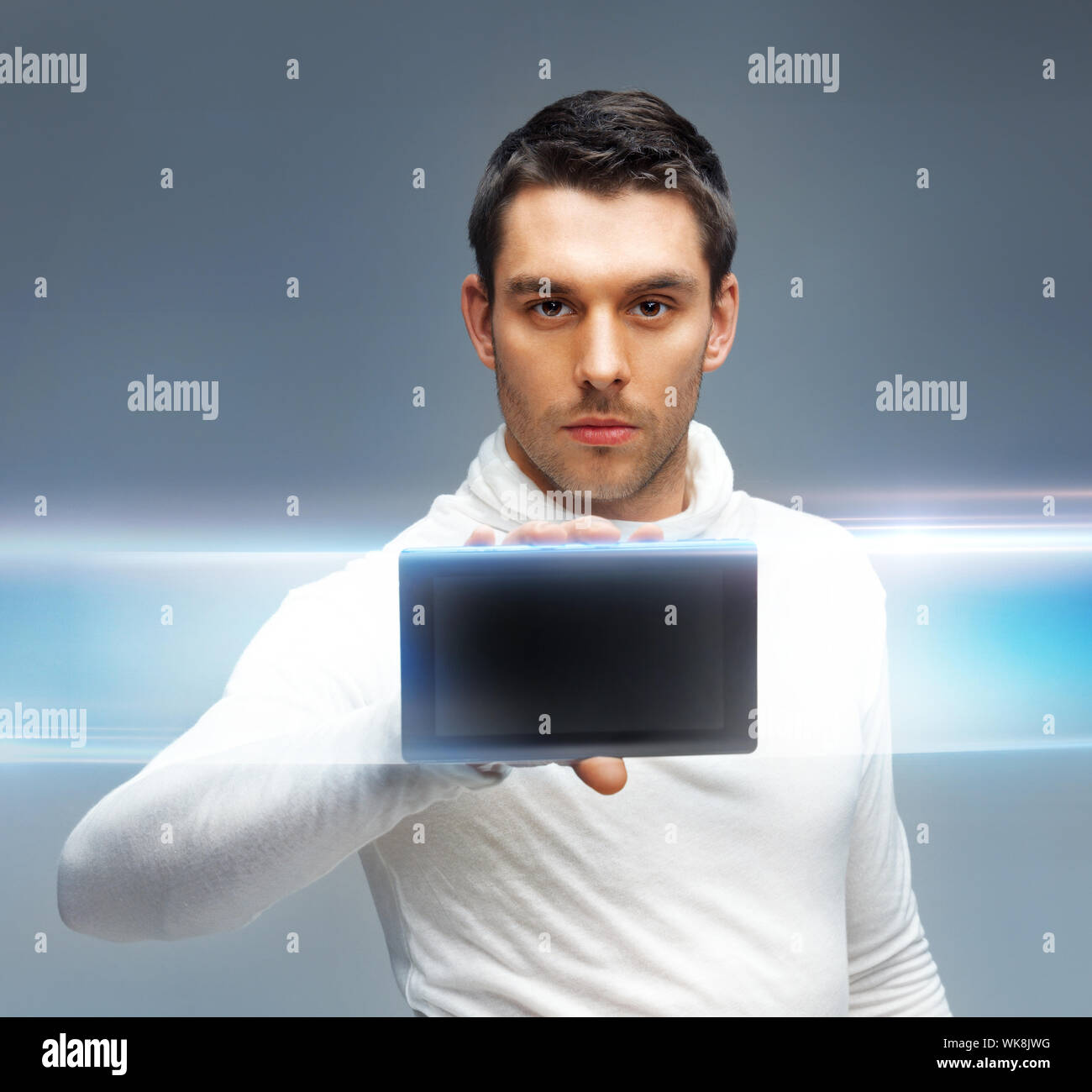 bright picture of futuristic man with tablet pc Stock Photo - Alamy