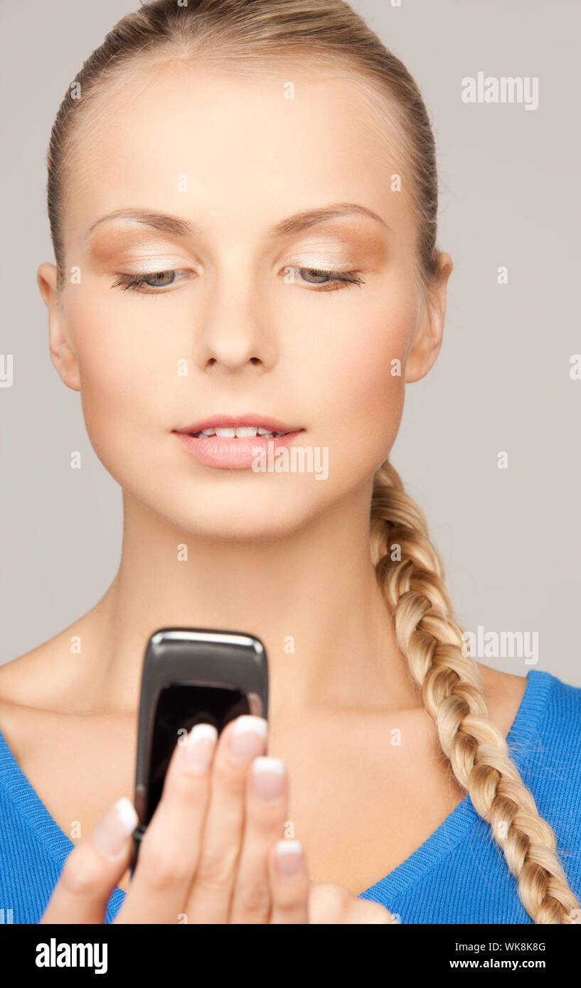 bright picture of woman with cell phone Stock Photo - Alamy