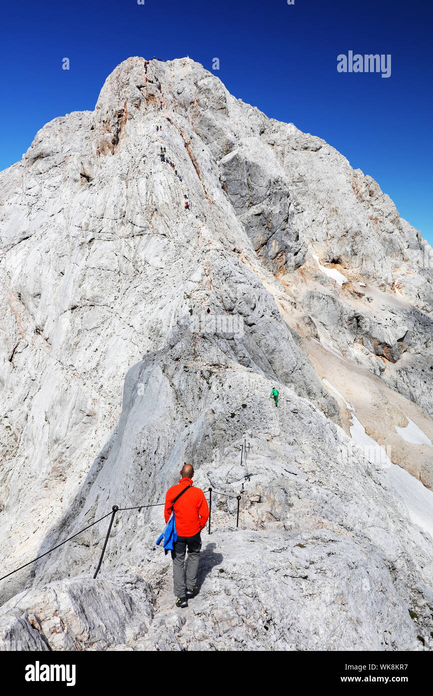 Man climbing cliff face hi-res stock photography and images - Alamy
