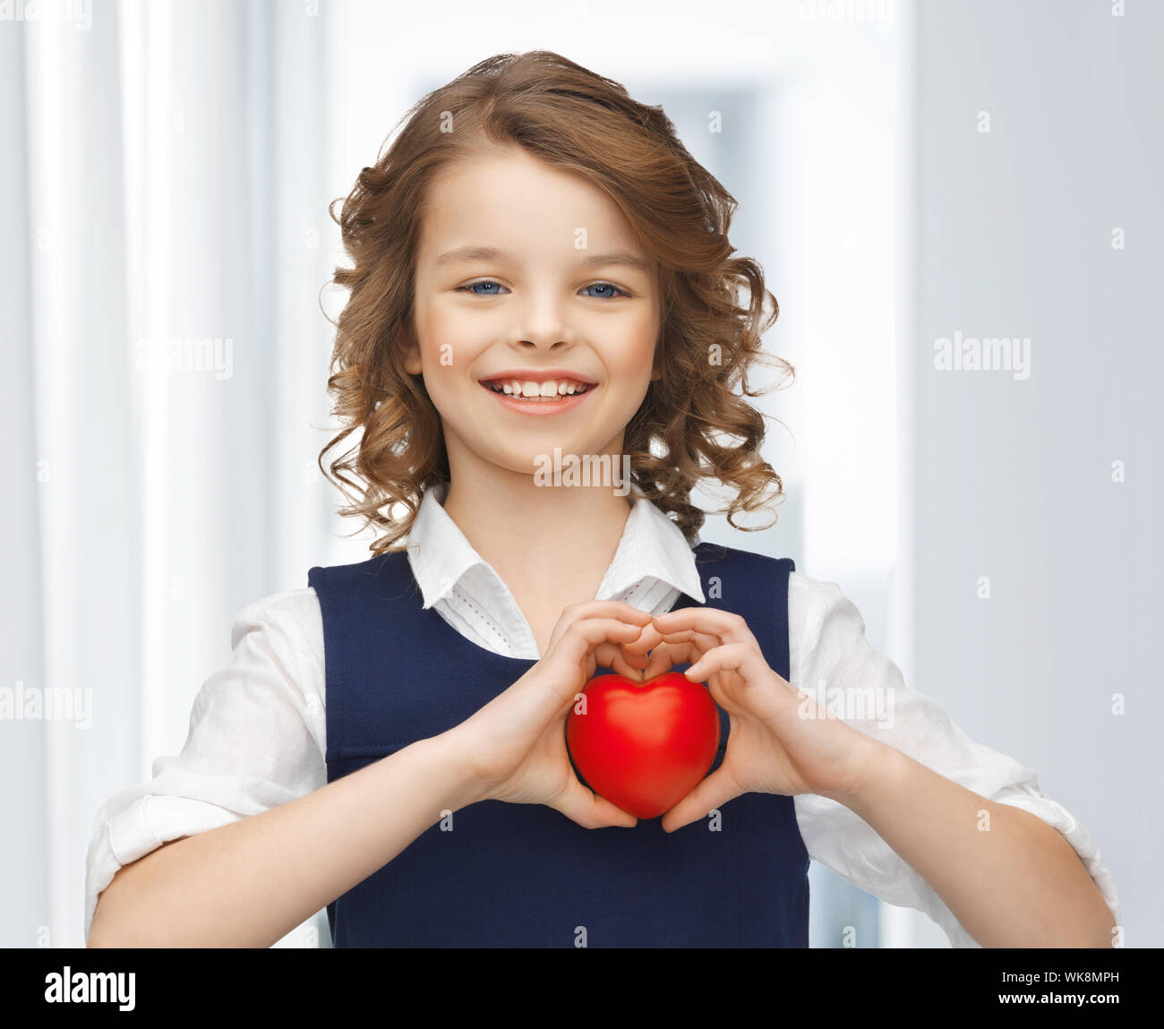 picture of beautiful girl with small heart Stock Photo - Alamy