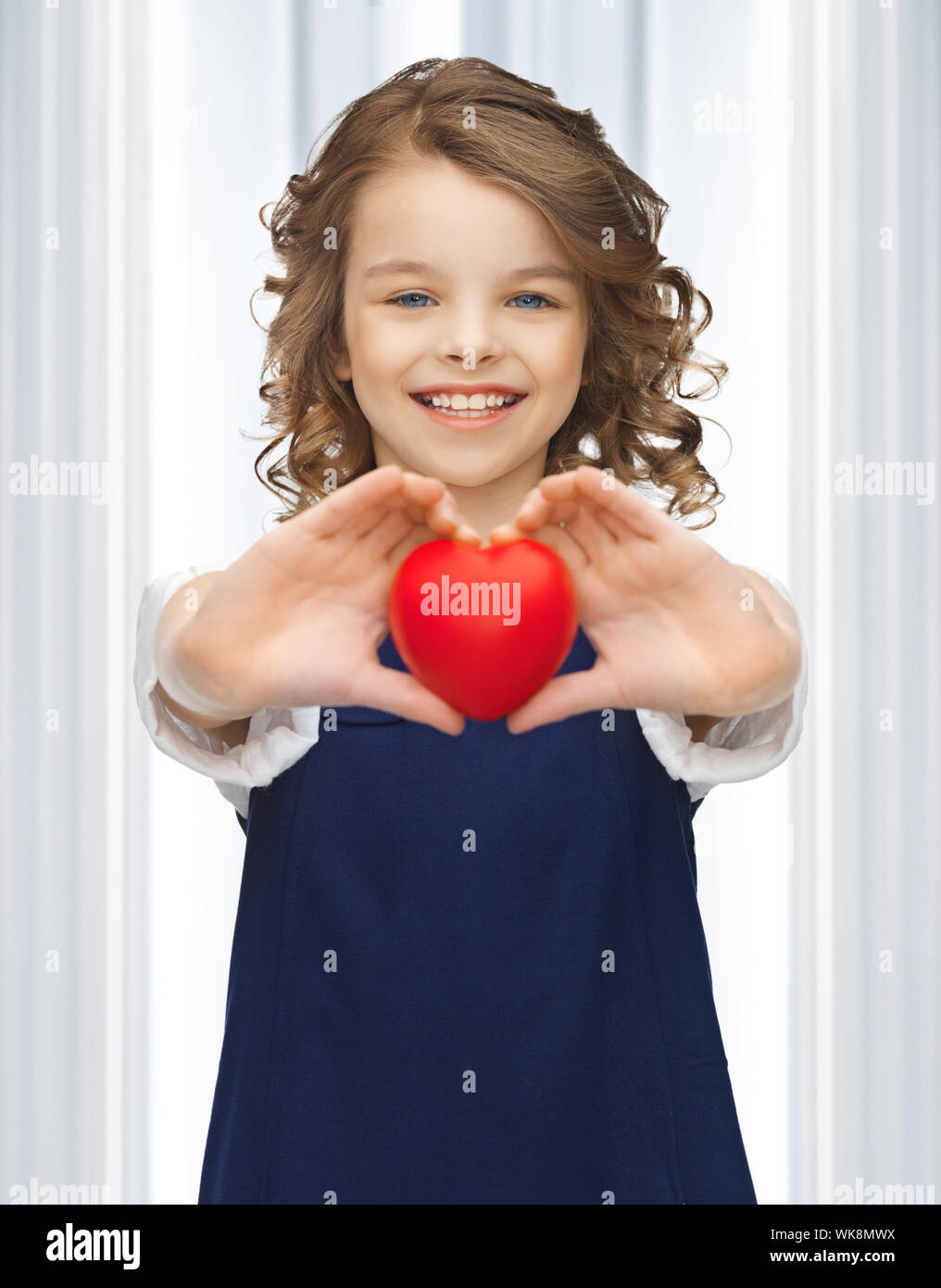 picture of beautiful girl with small heart Stock Photo - Alamy