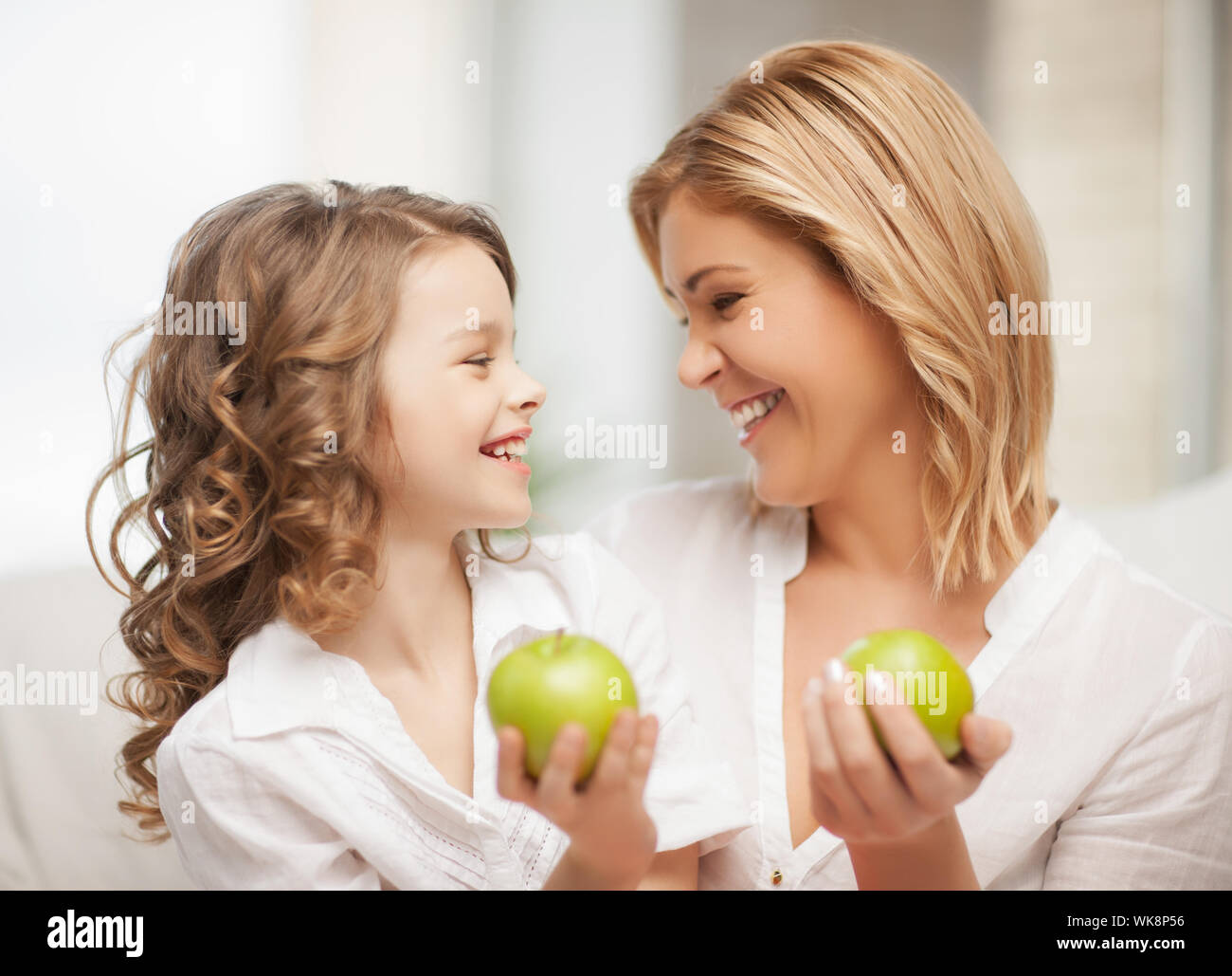 picture of mother and daughter with green apples Stock Photo - Alamy