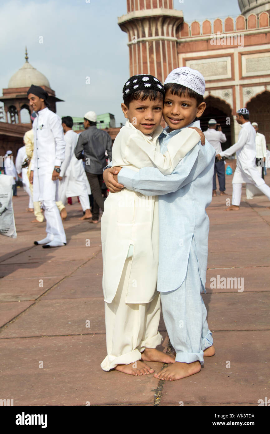 Muslim boys hugging to each other, Jama Masjid, Old Delhi, India Stock ...