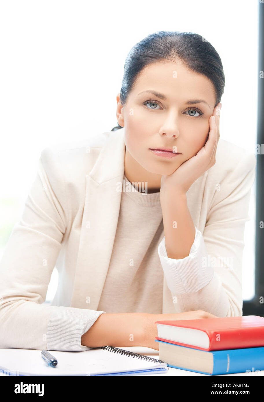 bored and tired woman behid the table Stock Photo - Alamy