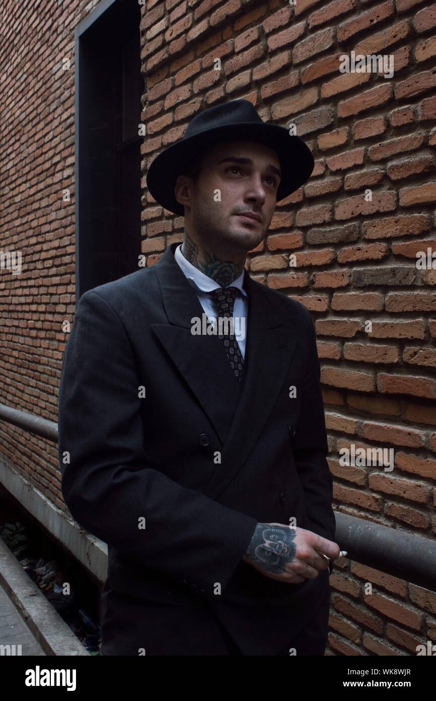 Man brick wall hi-res stock photography and images - Alamy