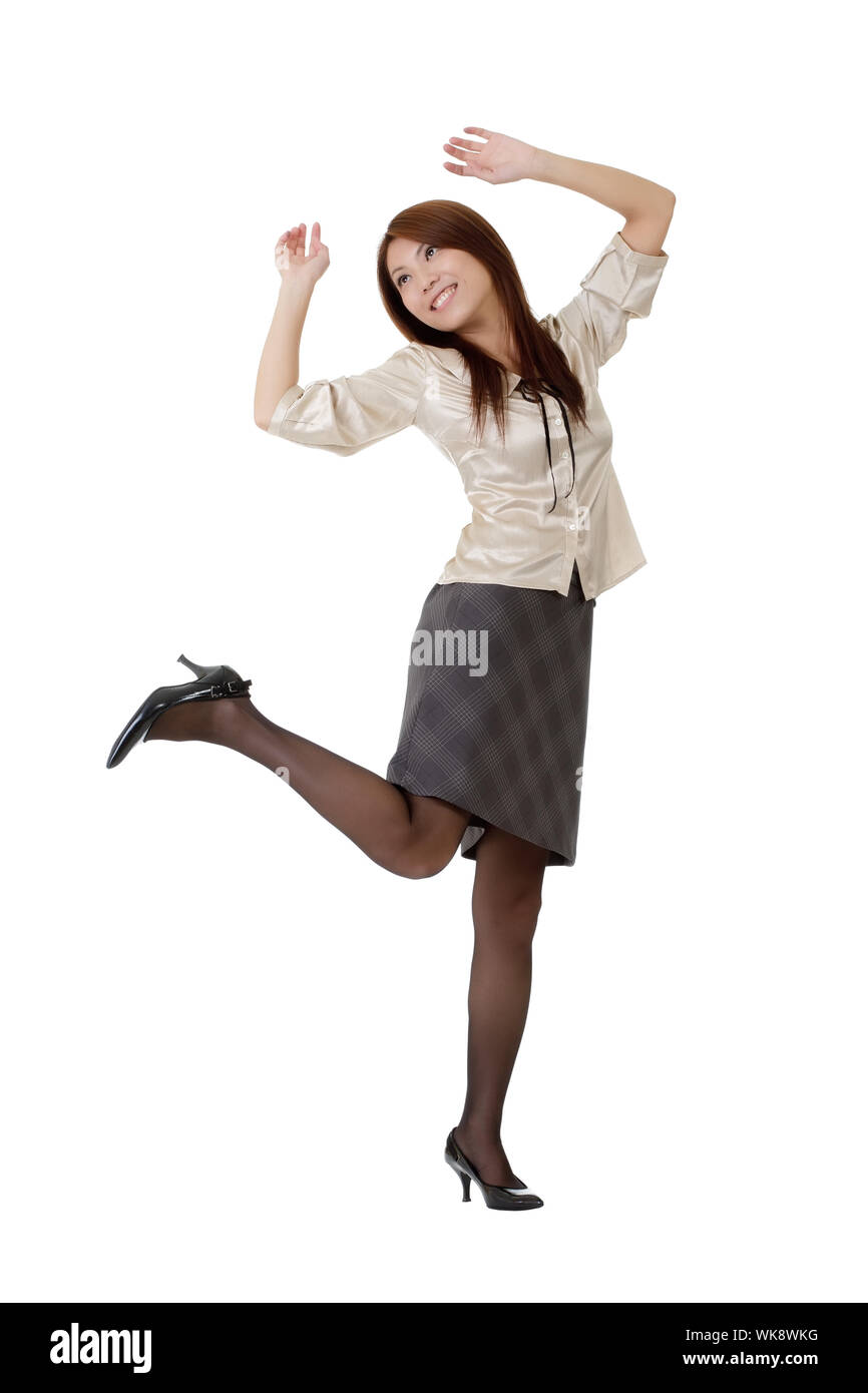 Happy business woman dancing and smiling isolated over white Stock ...