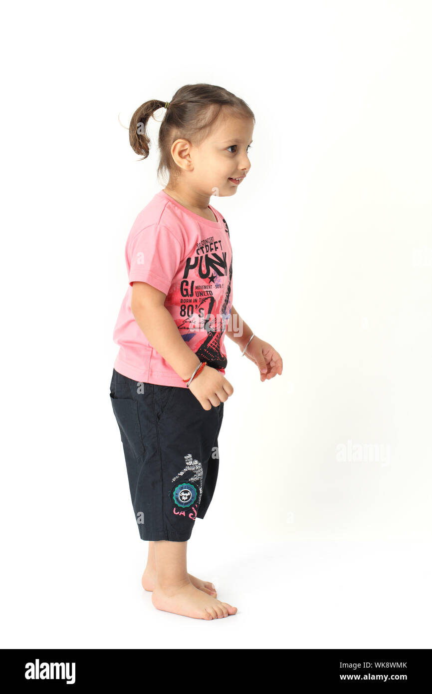 Side profile of girl standing isolated on white background Stock Photo ...