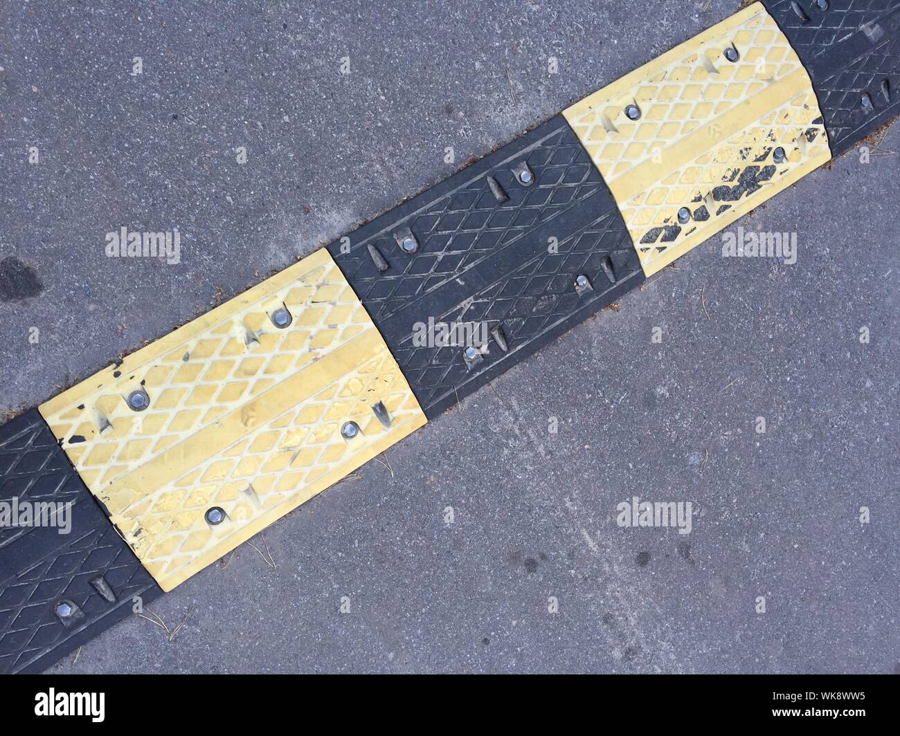 Asphalt speed bump hi-res stock photography and images - Alamy
