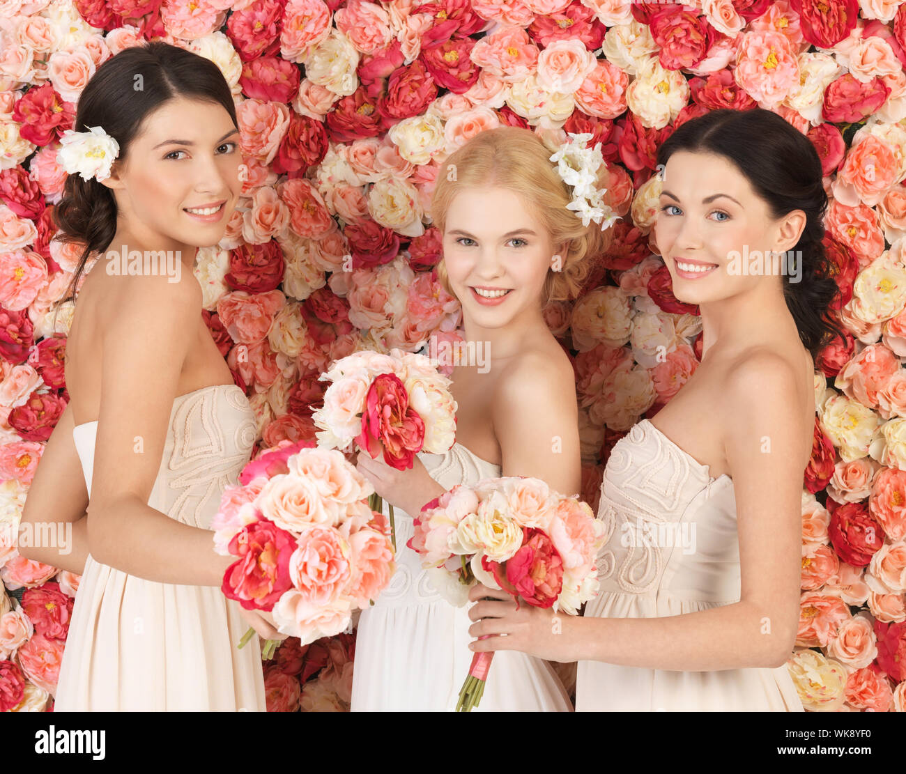 beautiful three women with background full of roses Stock Photo - Alamy