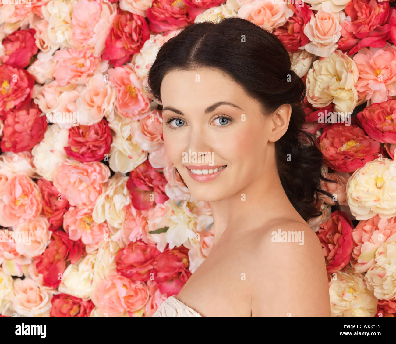 portrait of beautiful woman with background full of roses Stock Photo ...