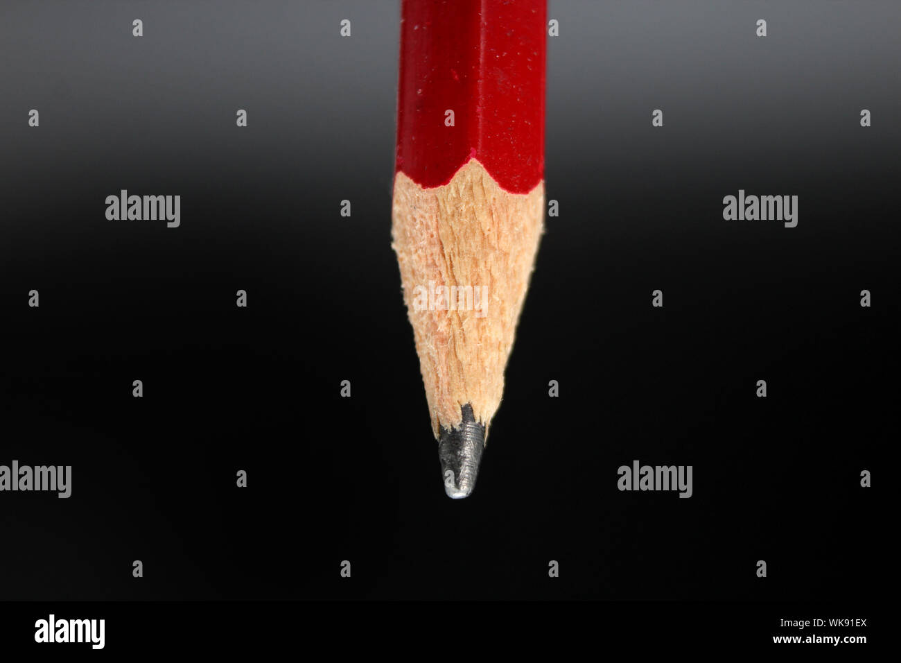 Red graphite pencil in vertical isolated on a white background Stock ...