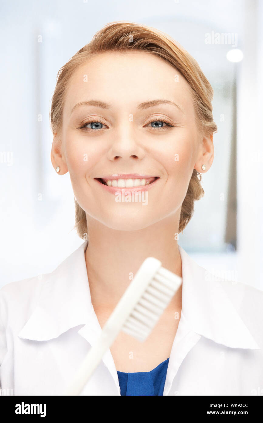 picture of attractive female doctor with toothbrush Stock Photo - Alamy