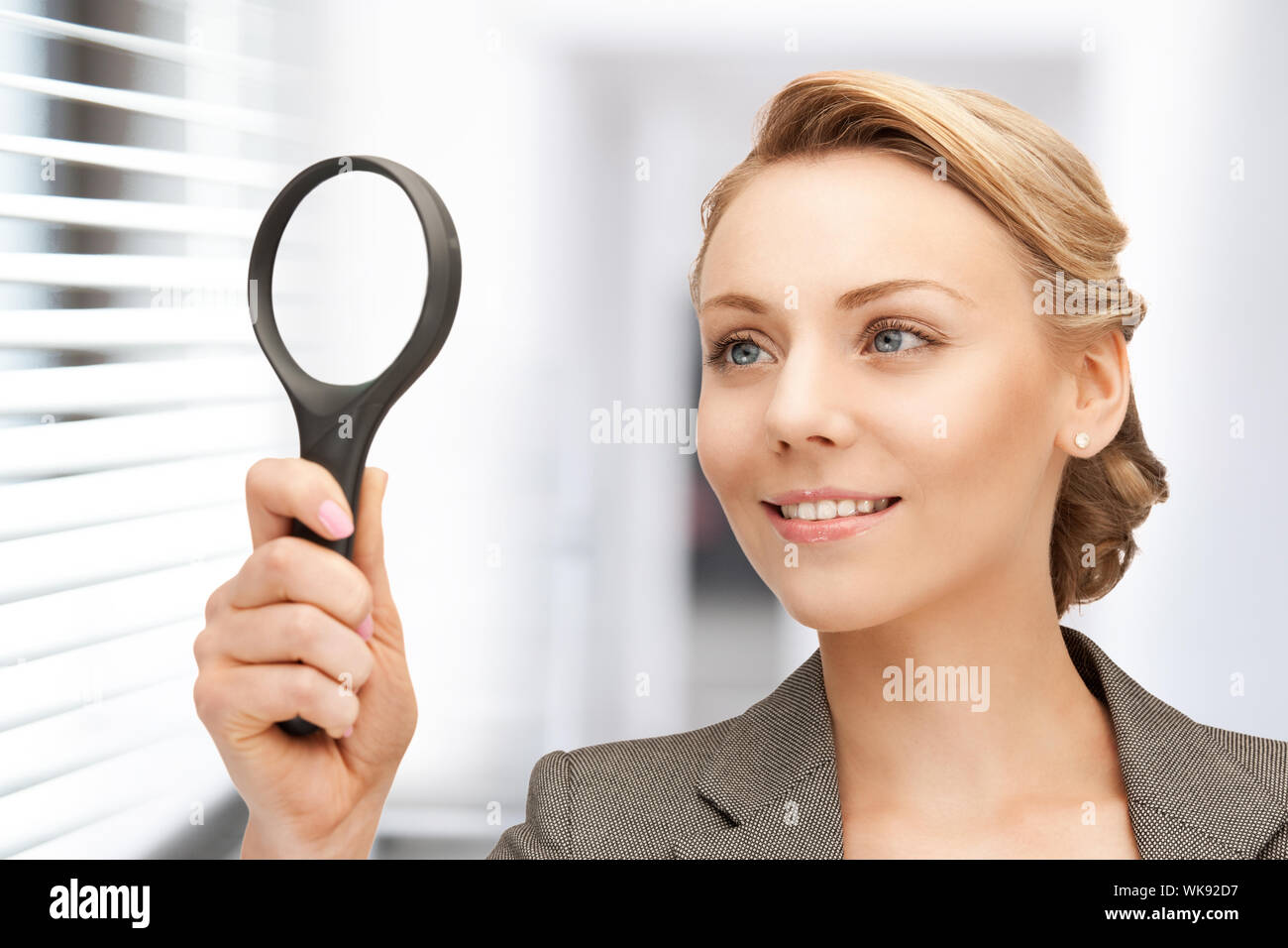 woman with magnifying glass Stock Photo - Alamy
