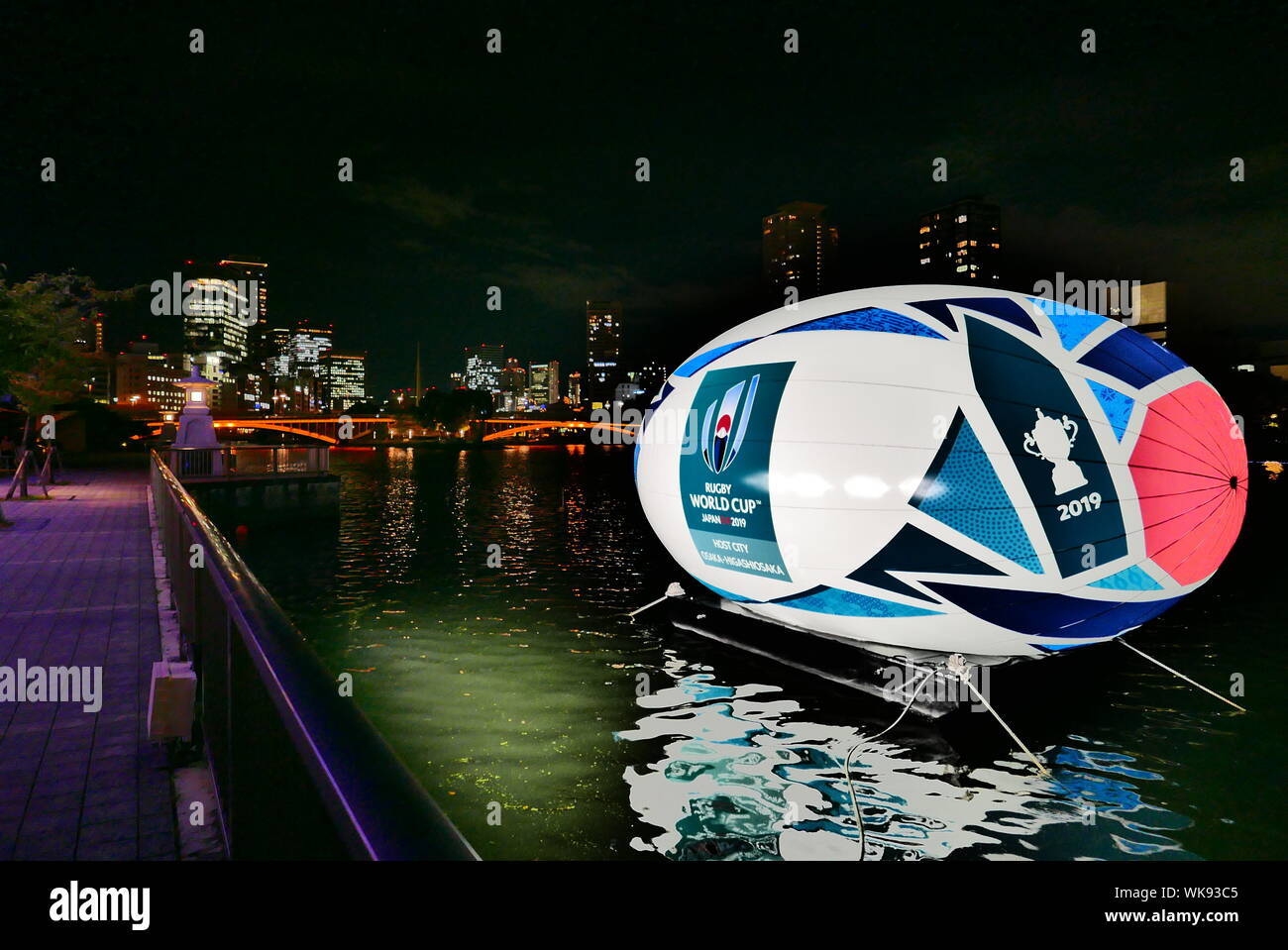 A giant rugby ball balloon floats on a river to promote the Rugby World ...